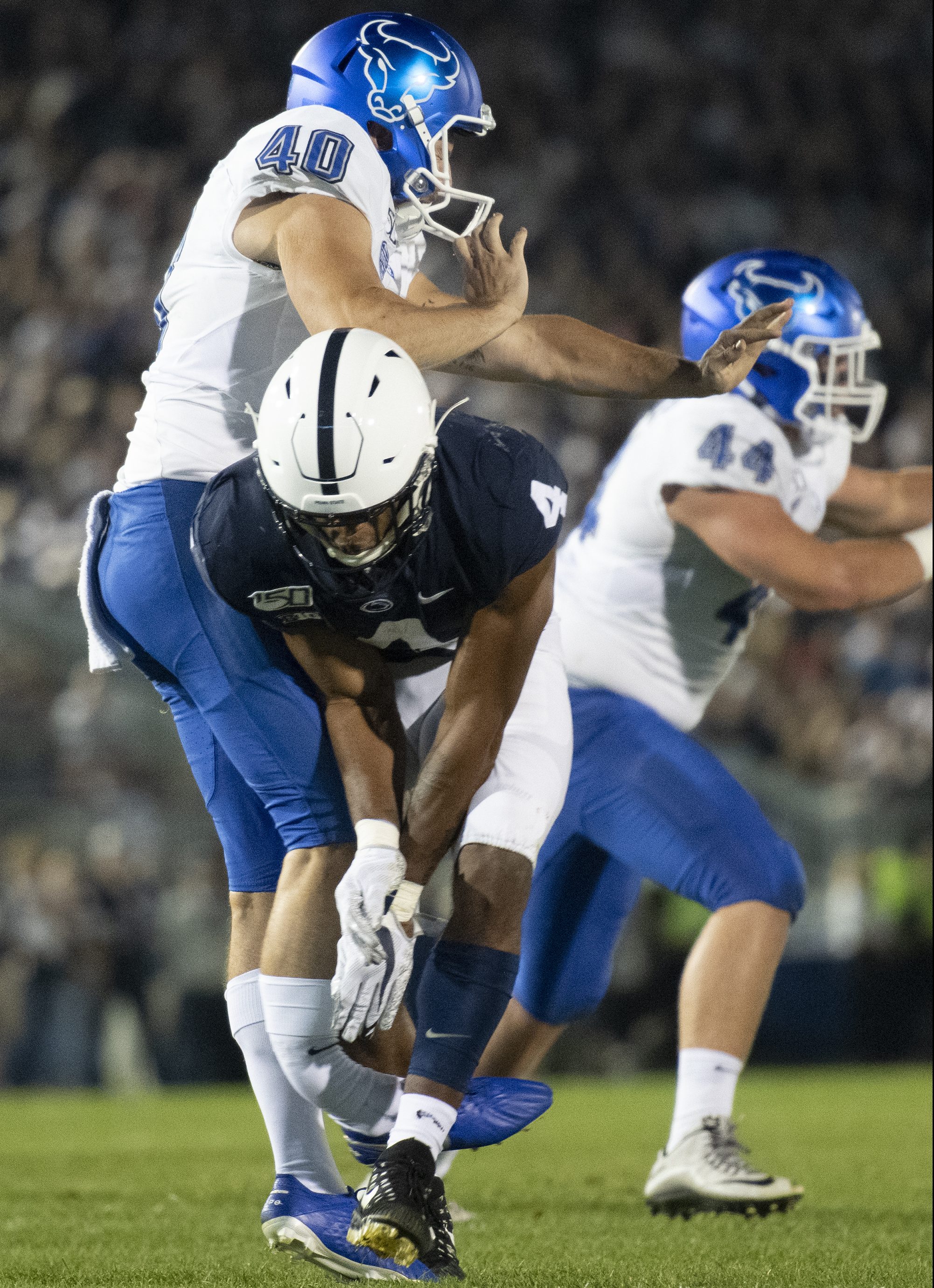 WATCH: Buffalo Punter Snaps Leg in Horrific On-Field Collision - FanBuzz
